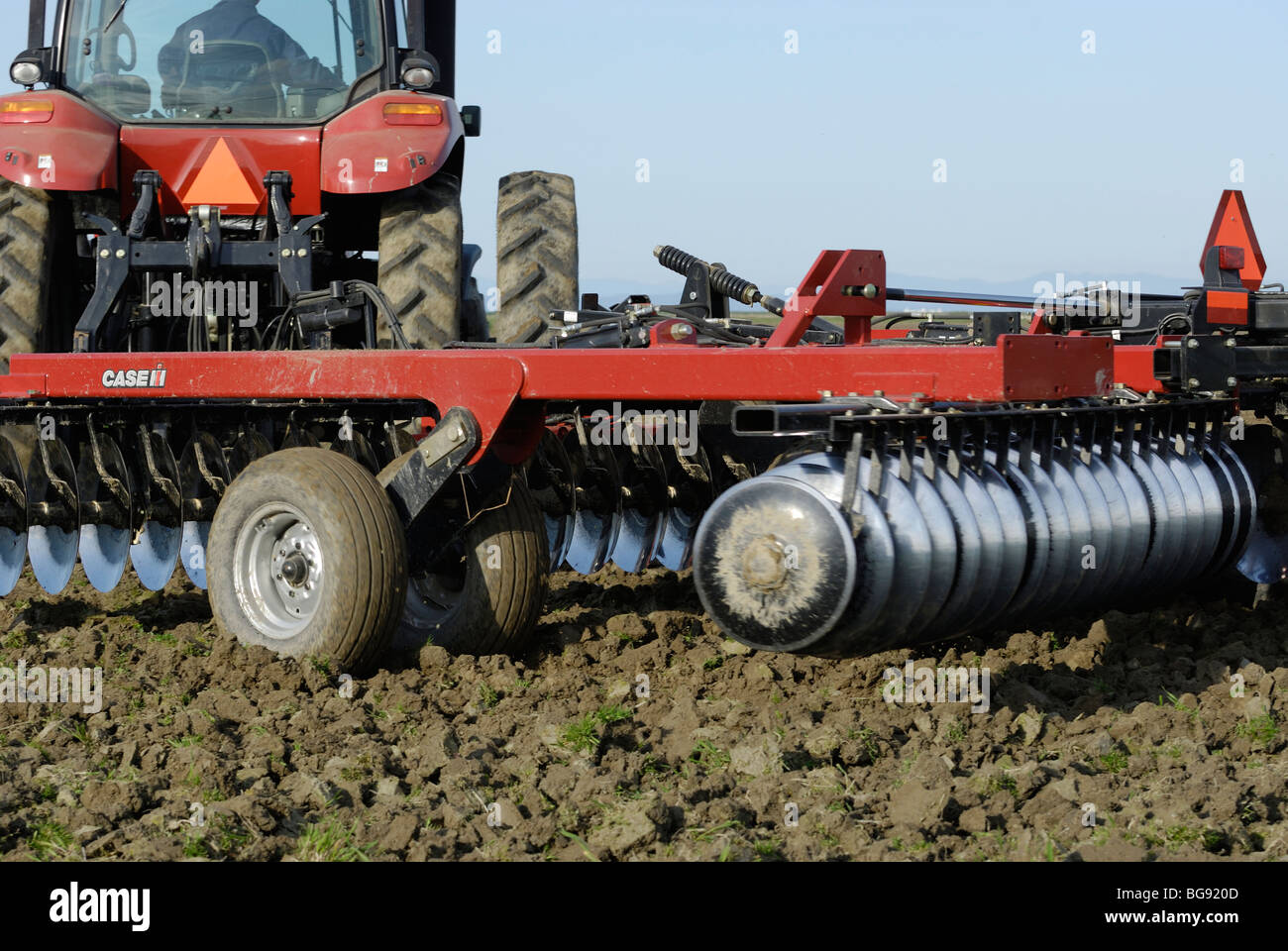 Close-up of Disk Rippers being pulled by a Case Tractor Stock Photo - Alamy