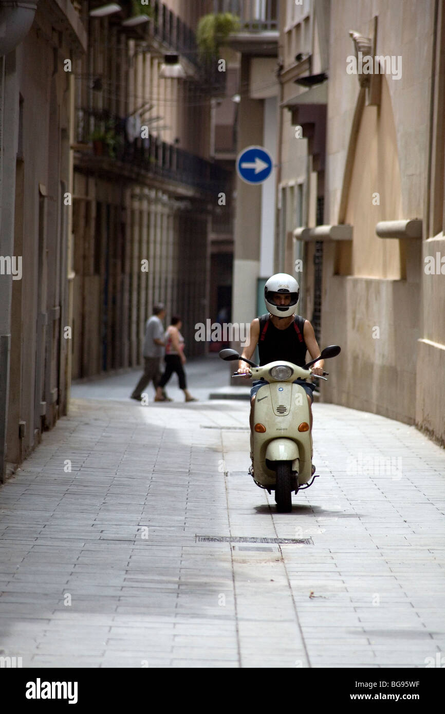 YOUNG MAN, MOPED, BARCELONA BACKSTREET: Cool young man on moped in ...