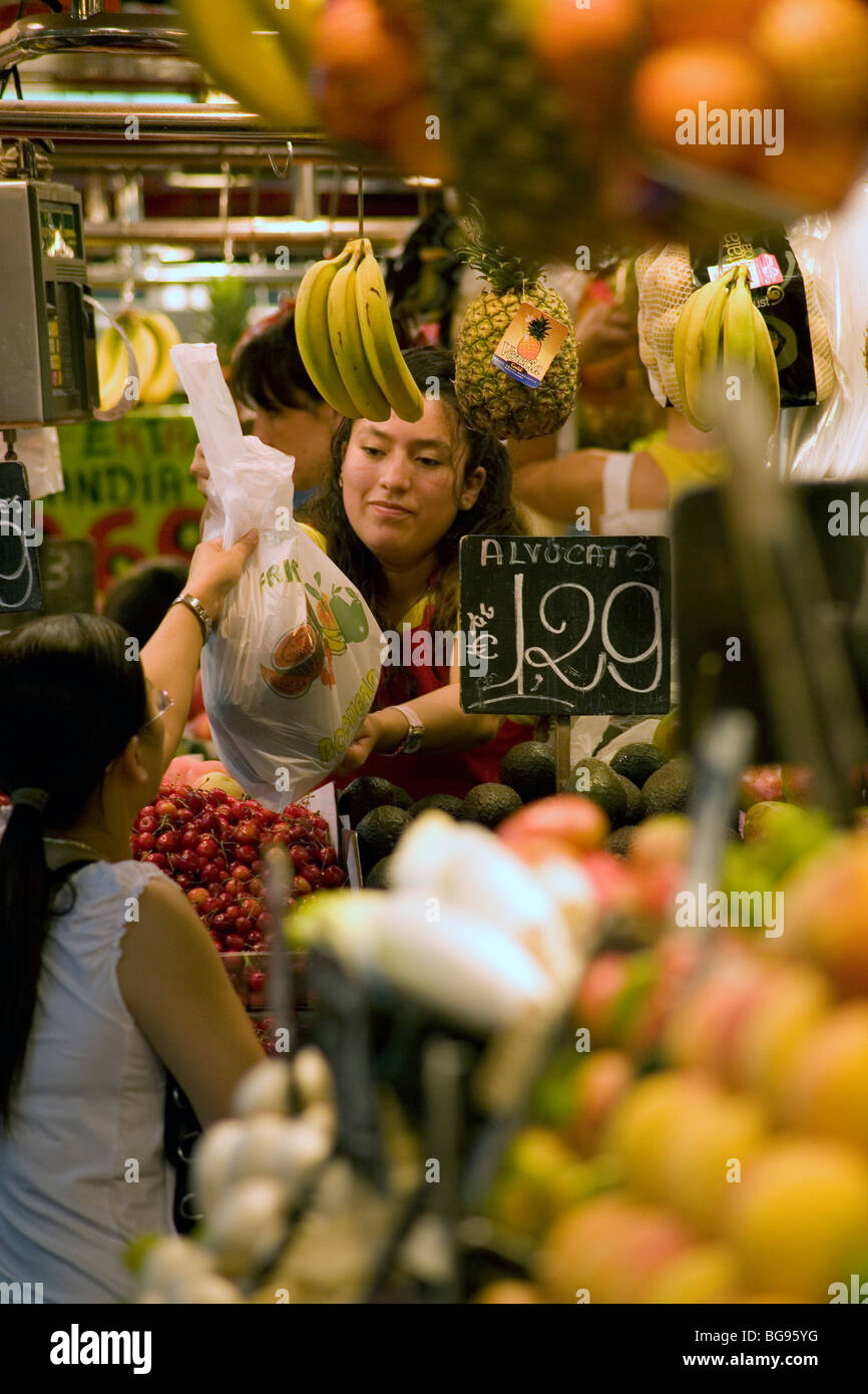 WOMAN BUYING FRUIT, ST JOSEPH MARKET, LAS RAMBLAS: Central market stall ...