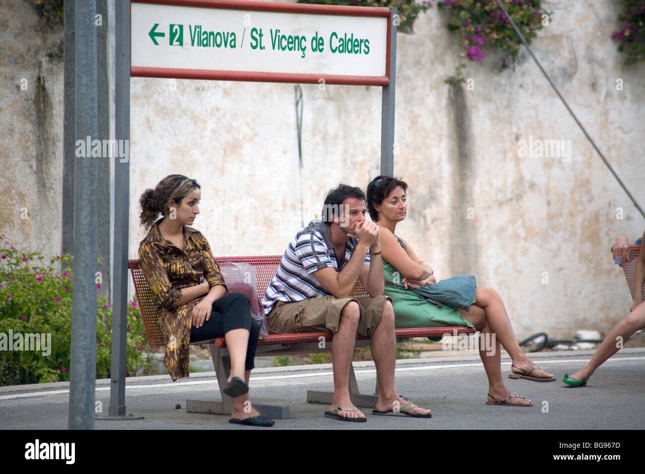 BEFORE MOBILE PHONES, 2007: Tourists waiting on a bench thinking on the ...