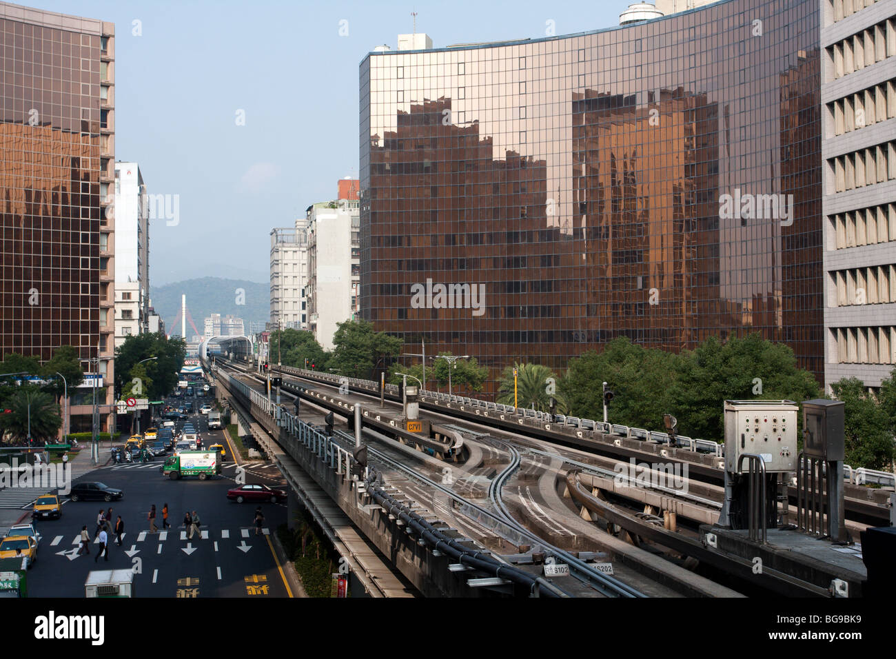 An Innovia APM 256 train traveling on elevated rails approaches the ...