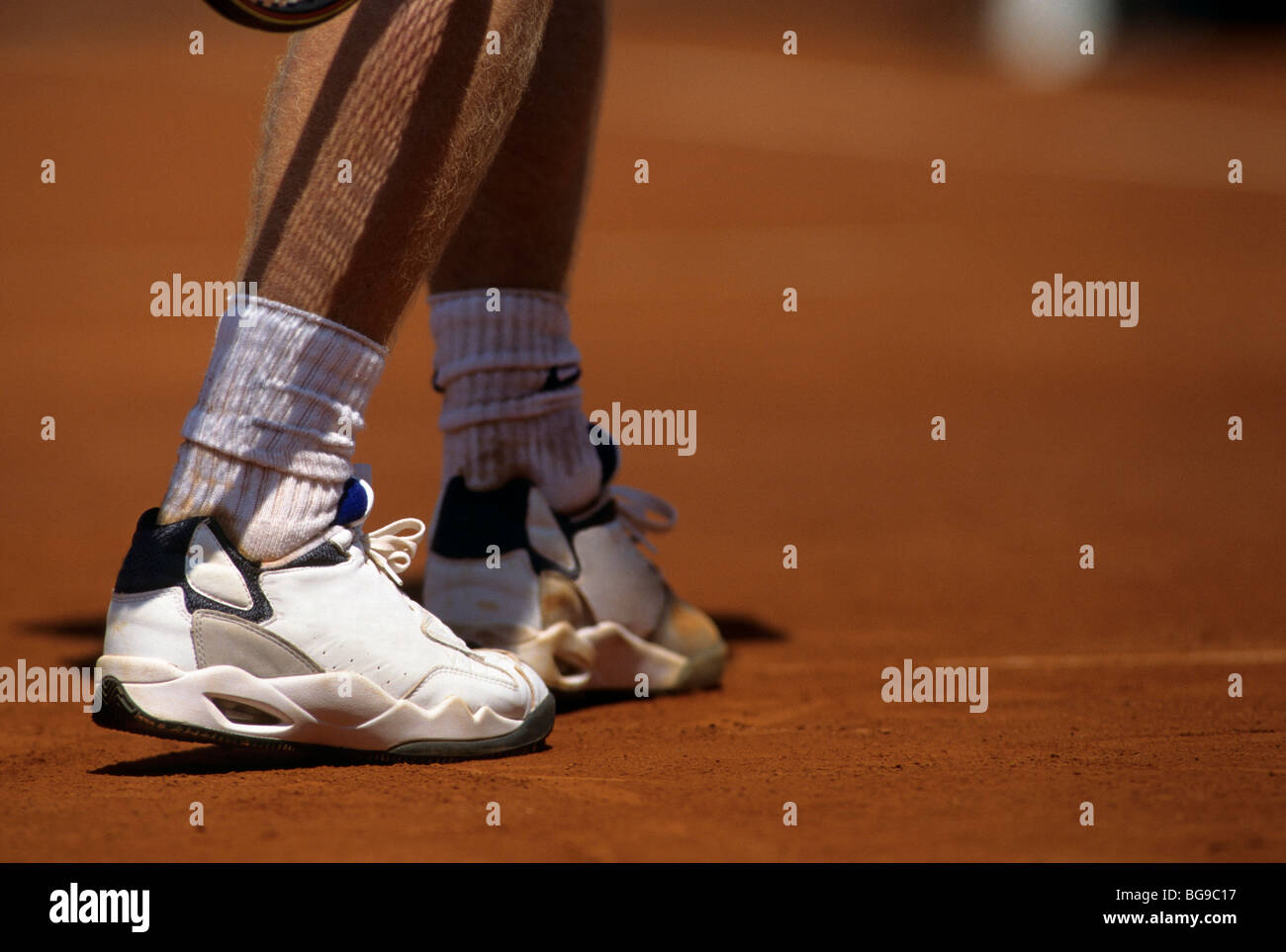Tennis player on a clay court Stock Photo - Alamy