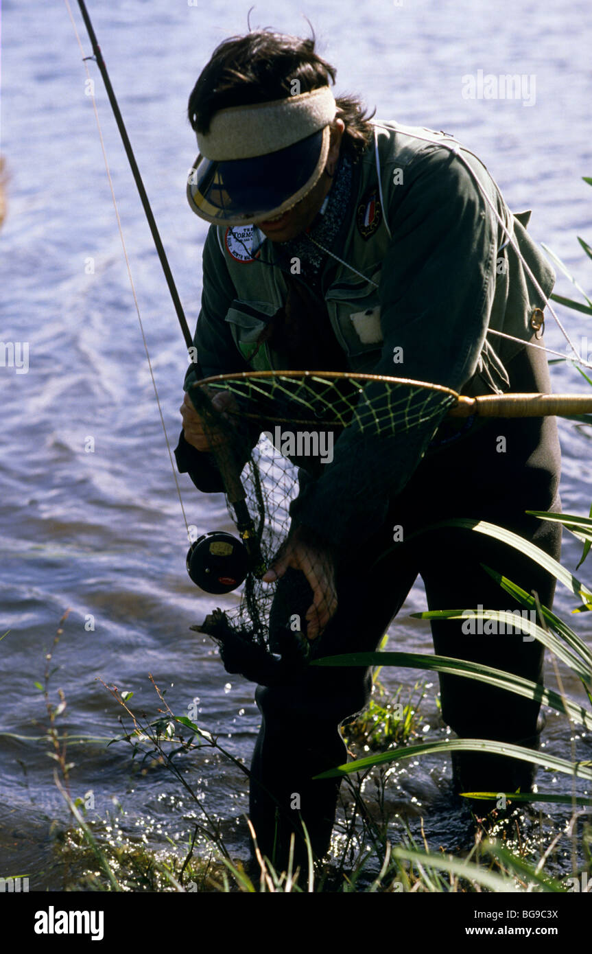 Catching a fish Stock Photo - Alamy