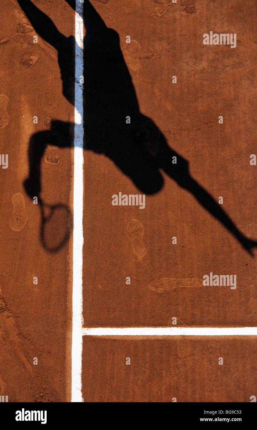 Shadow of a tennis player on a clay court Stock Photo - Alamy