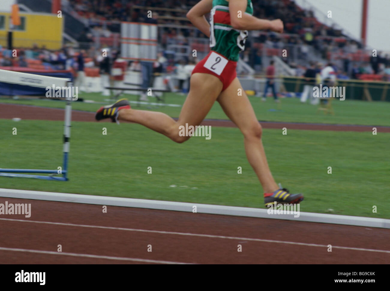 Sprinter running on a track Stock Photo - Alamy