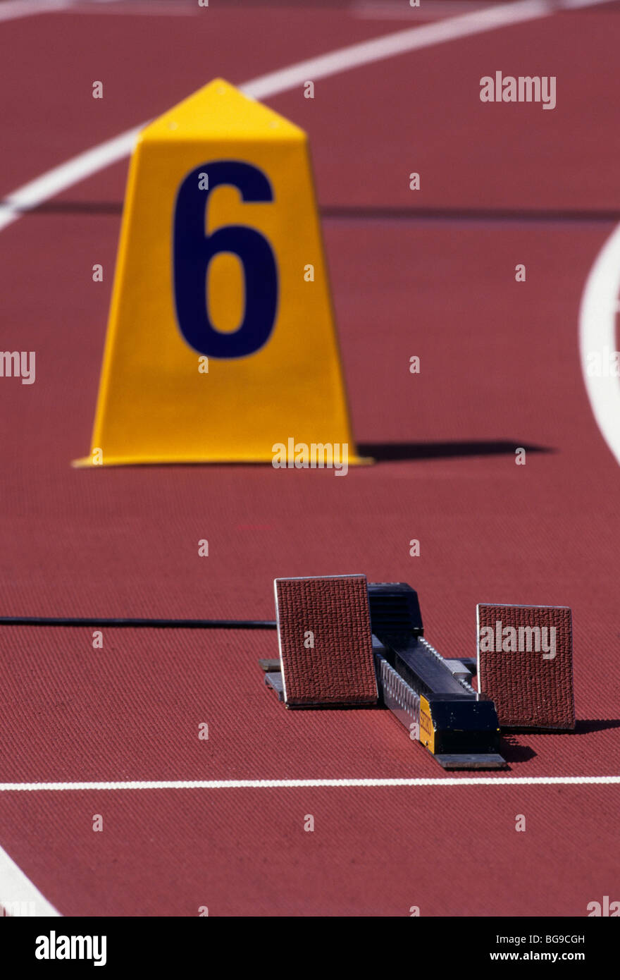 Starting block and lane marker on an running track Stock Photo - Alamy