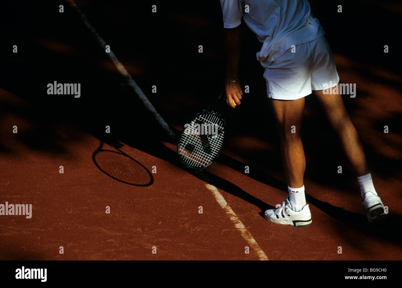 Tennis player on a clay court Stock Photo - Alamy