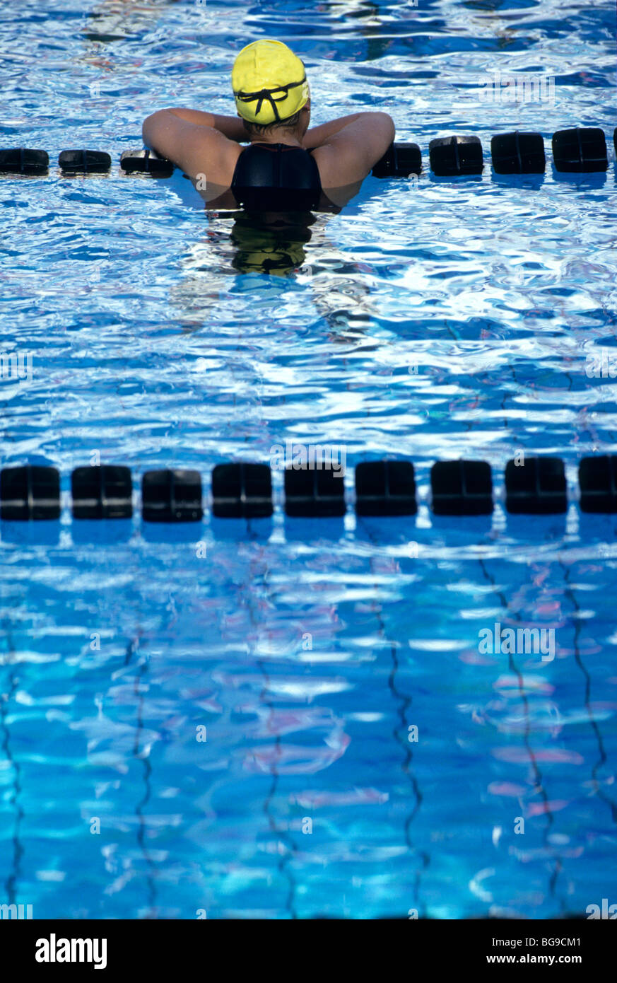 Swimmer leaning on a lane marker Stock Photo - Alamy