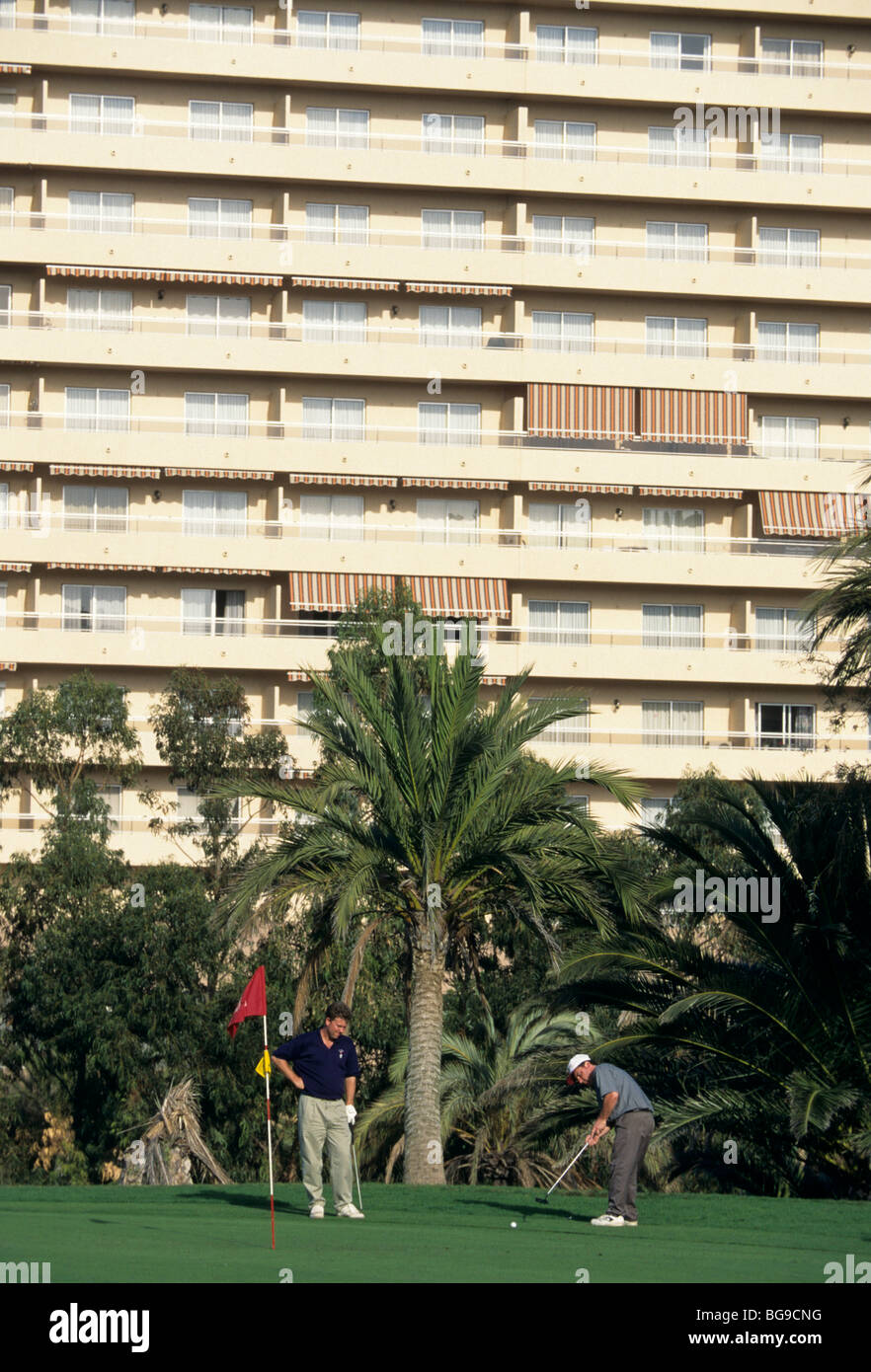 Golfers on a resort golf course Stock Photo - Alamy