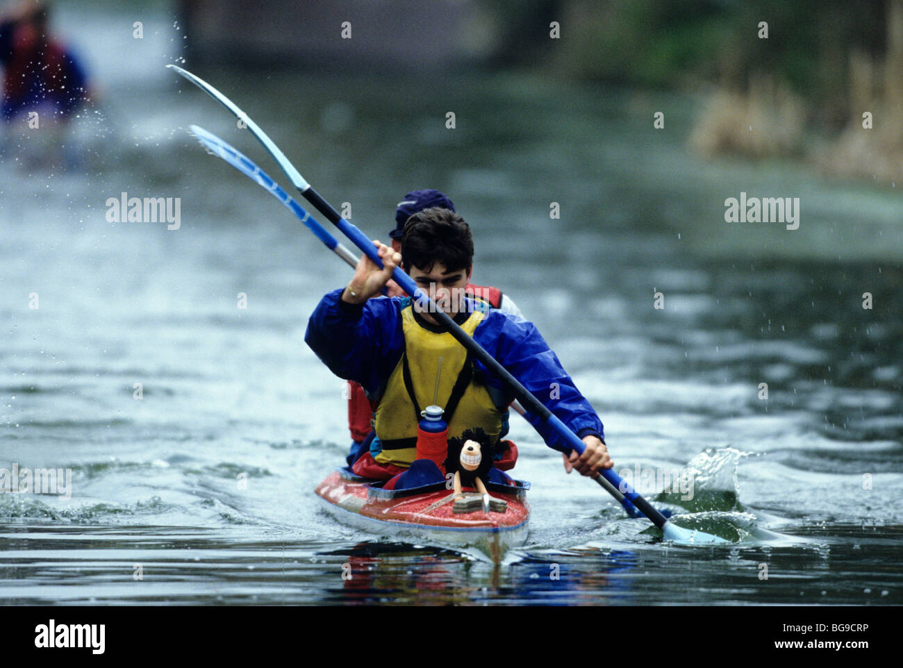 Two men Kayaking on a river Stock Photo - Alamy
