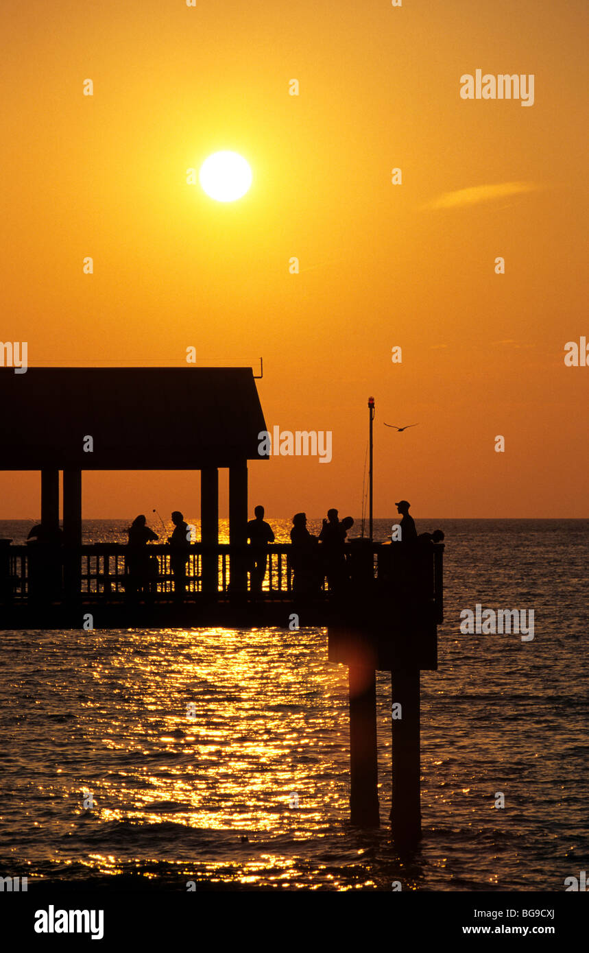 Silhouette of a group pier fishing Stock Photo - Alamy