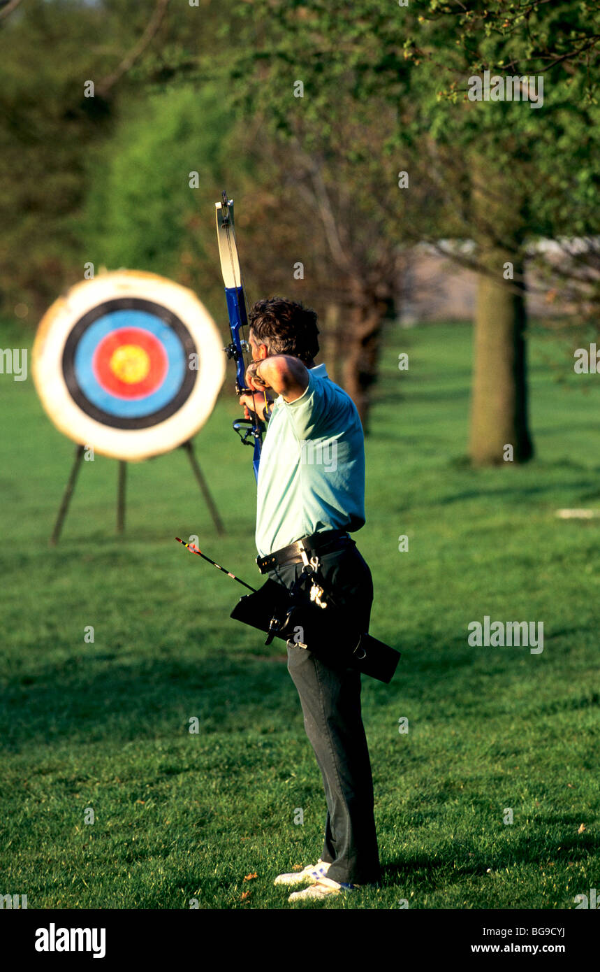 Male archer taking aim at a target Stock Photo - Alamy