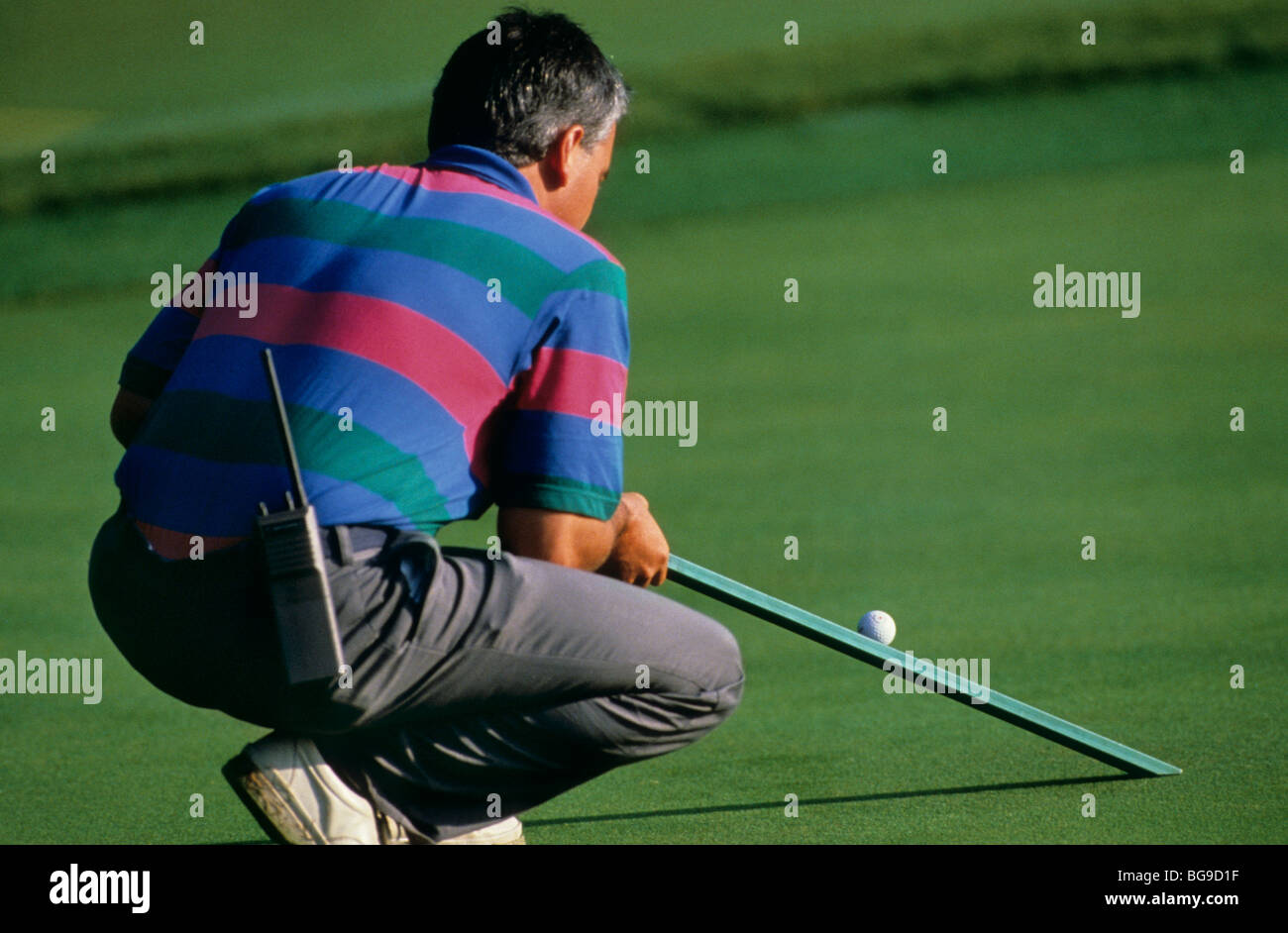 Grounsdman with a stimp meter Stock Photo - Alamy