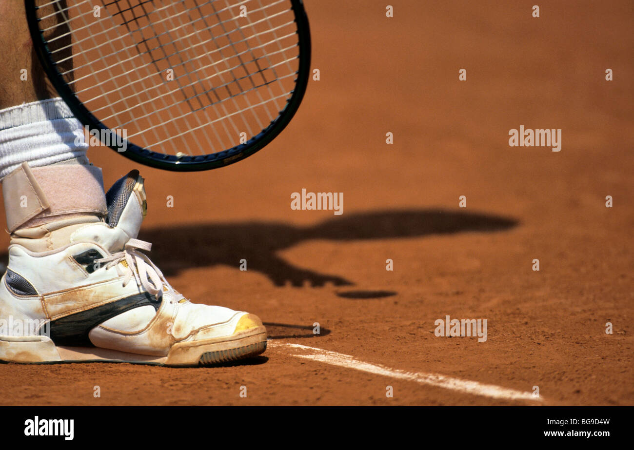 Tennis player on a clay court Stock Photo - Alamy