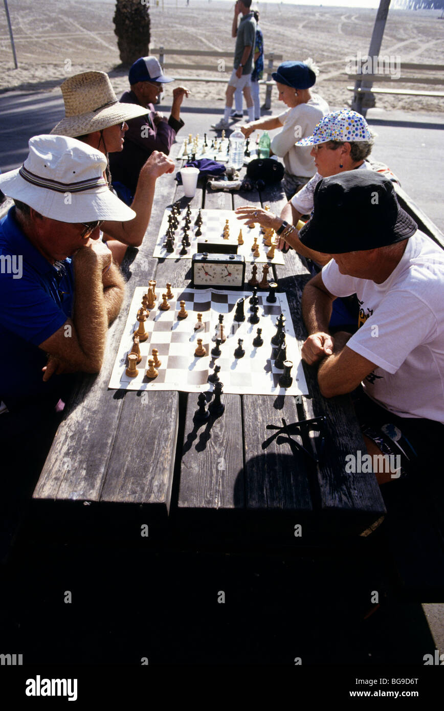 People playing chess by the beach Stock Photo - Alamy