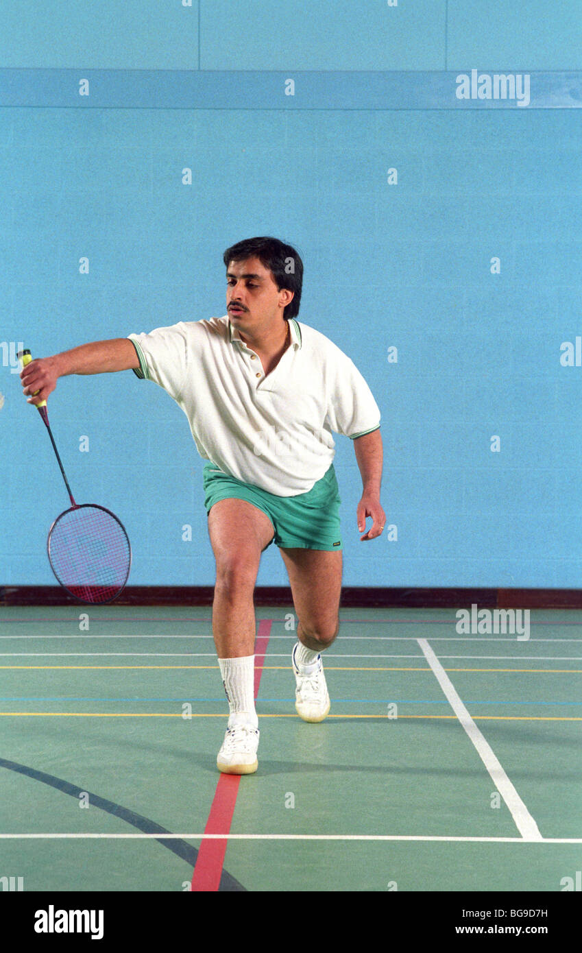 Man playing badminton Stock Photo - Alamy