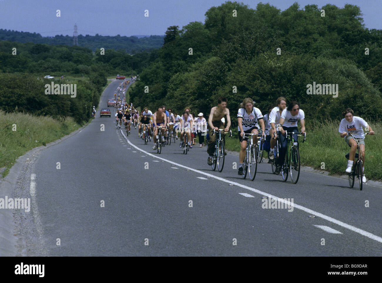 Large group of cyclists on a country road Stock Photo - Alamy