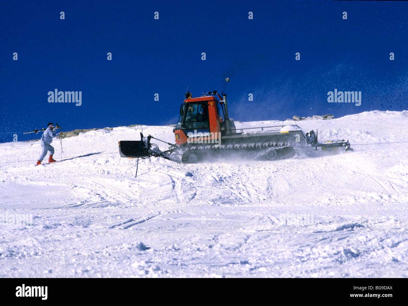 Snow plough on a ski slope Stock Photo - Alamy