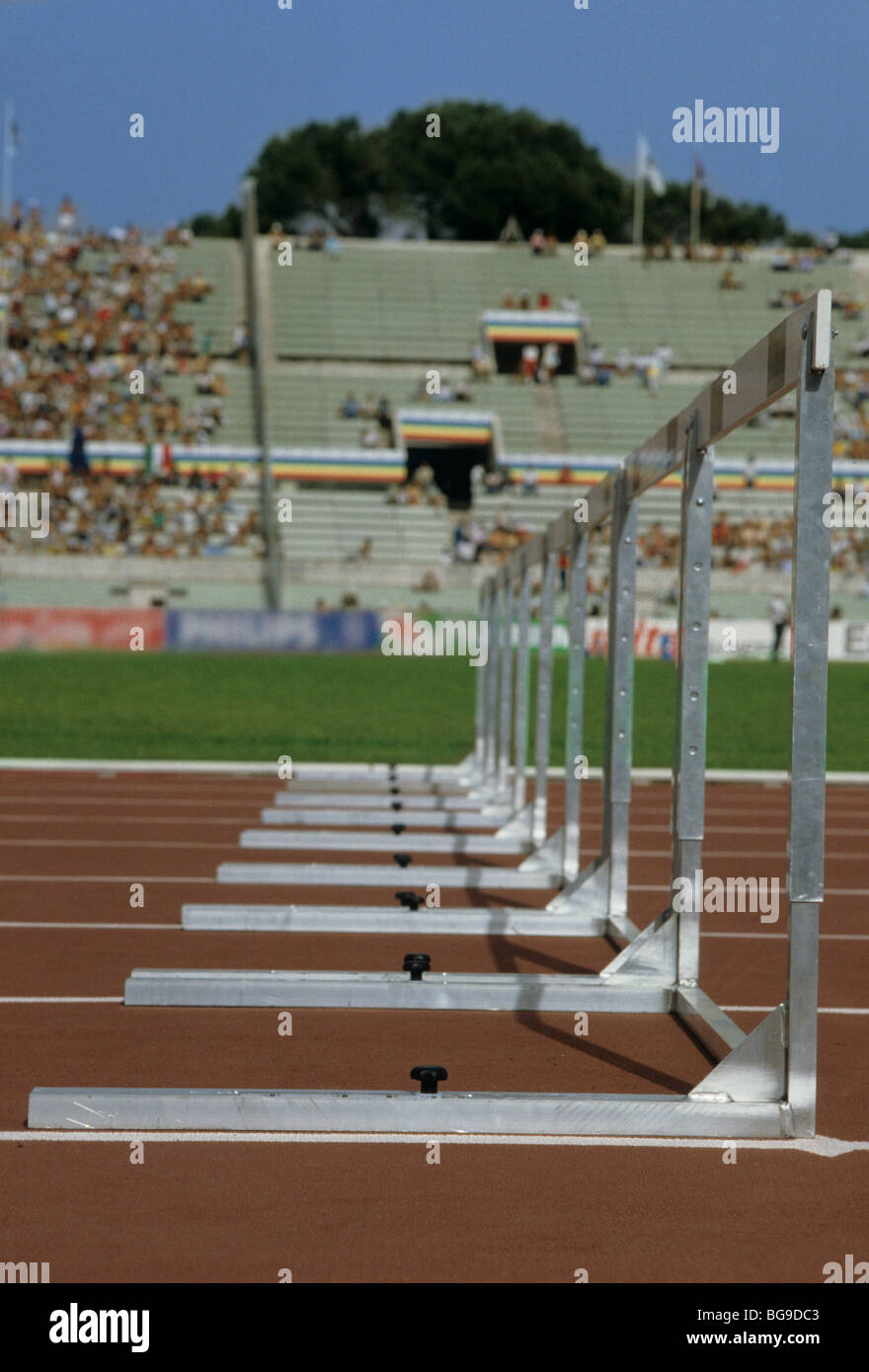 Side view of hurdles on a running track Stock Photo - Alamy