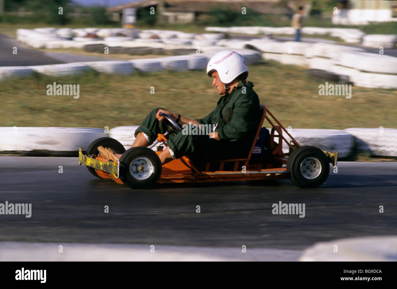 Man driving a go kart around a corner Stock Photo - Alamy