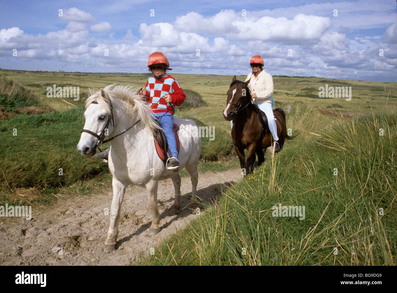 Horse riders on a country path Stock Photo - Alamy