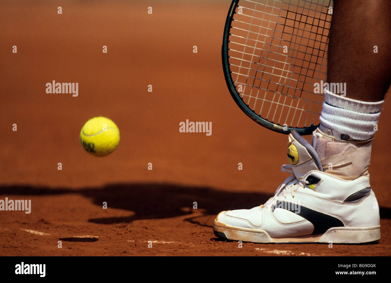 Tennis player on a clay court Stock Photo - Alamy