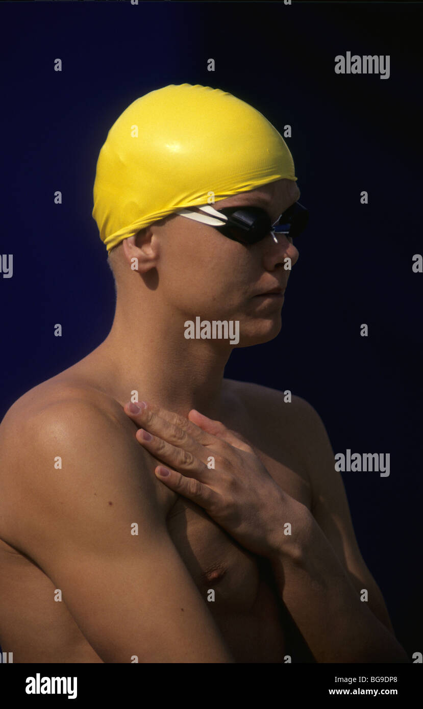 Swimmer in a yellow swim cap and goggles Stock Photo - Alamy
