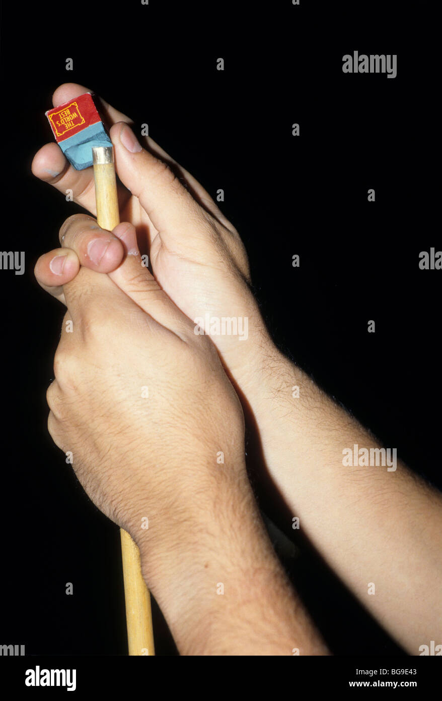 Man chalking a snooker cue Stock Photo - Alamy