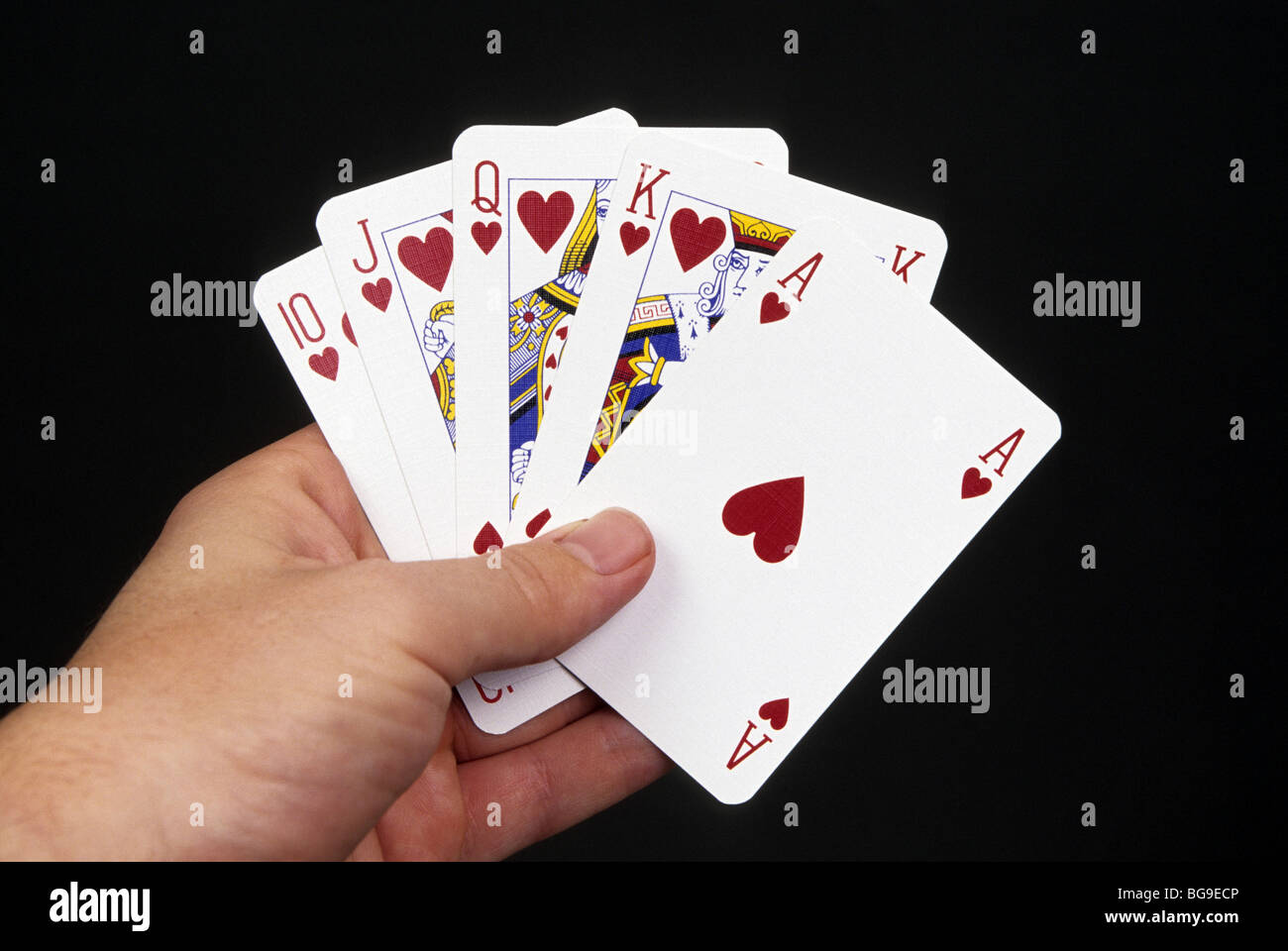 Man holding a royal flush of cards Stock Photo - Alamy