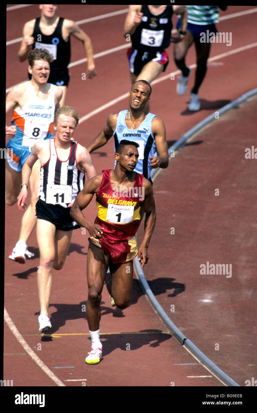 Group of male runners racing on a track Stock Photo - Alamy