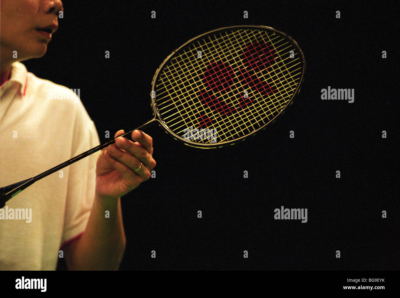Close up of a badminton player holding his racquet Stock Photo - Alamy