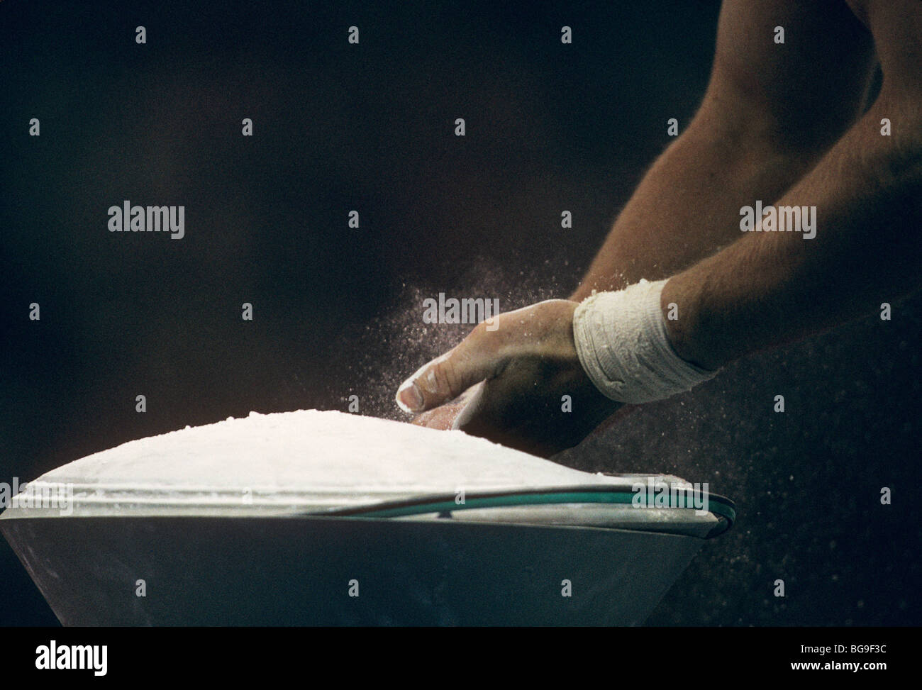 male gymnast chalking hands Stock Photo - Alamy