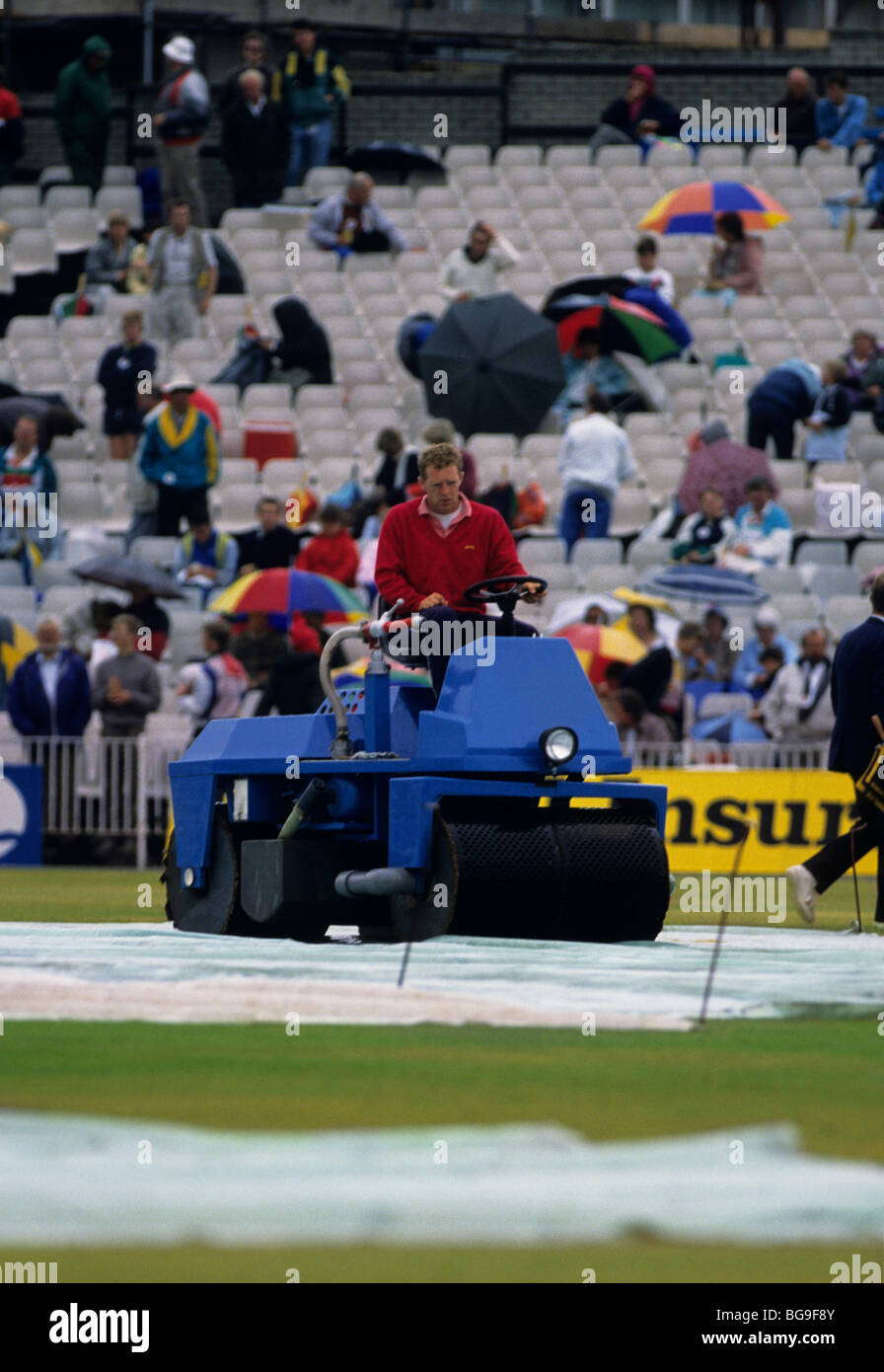 Man driving a bowdry over a cricket pitch Stock Photo - Alamy
