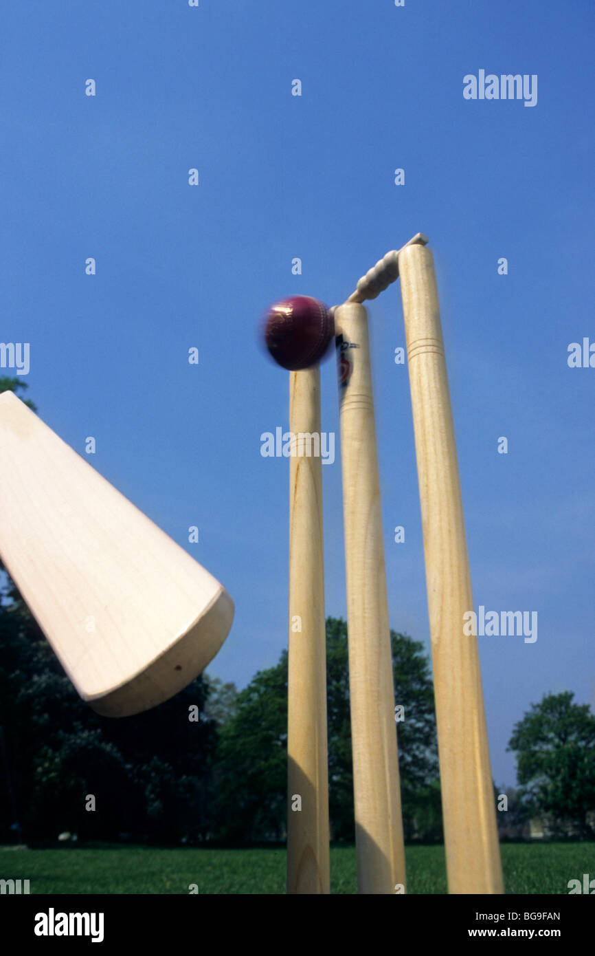 Close up of red cricket ball about to strike the stumps Stock Photo - Alamy