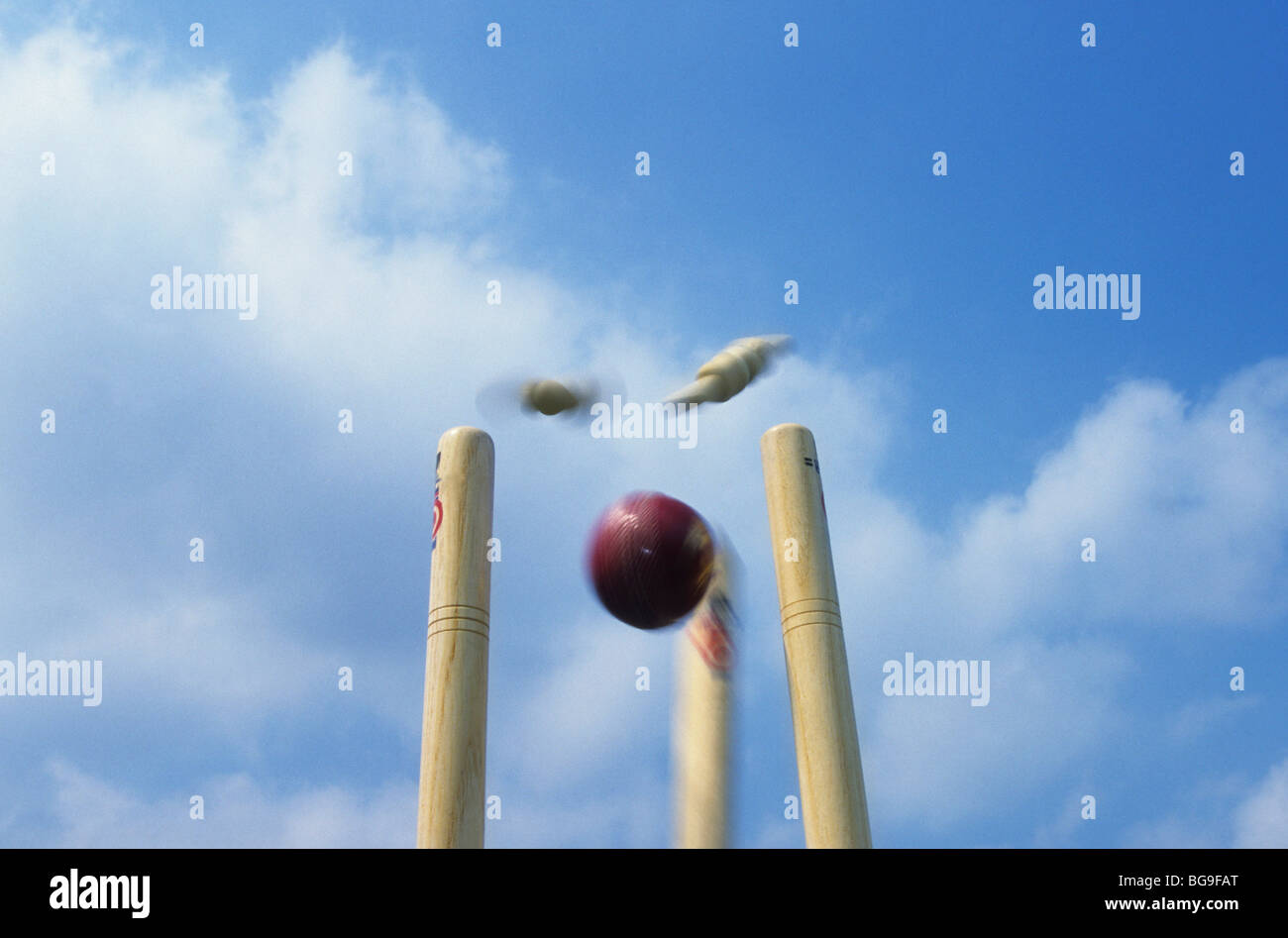 Close up of red cricket ball about to strike the stumps Stock Photo - Alamy