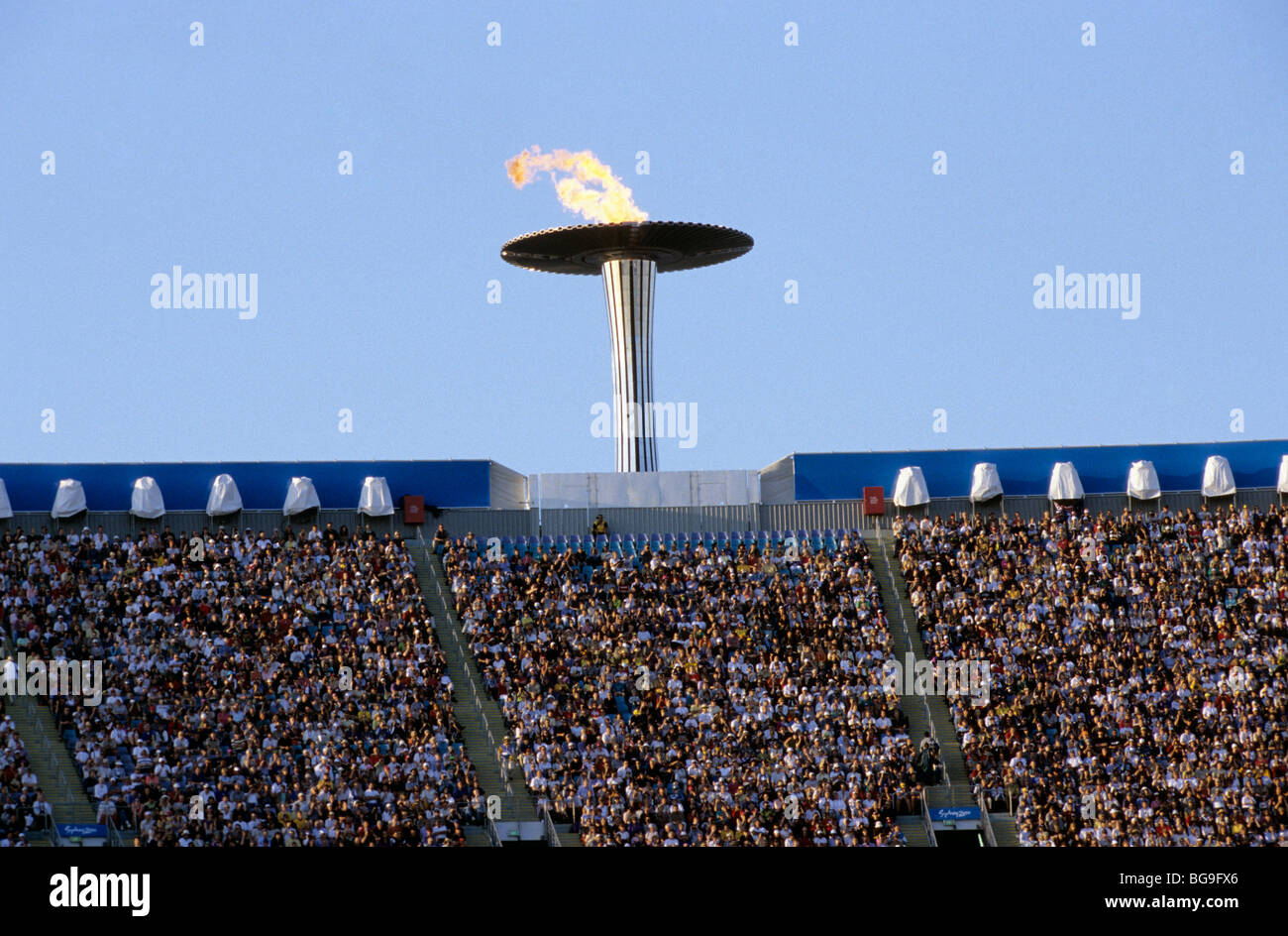 Olympic torch above a stadium Stock Photo - Alamy