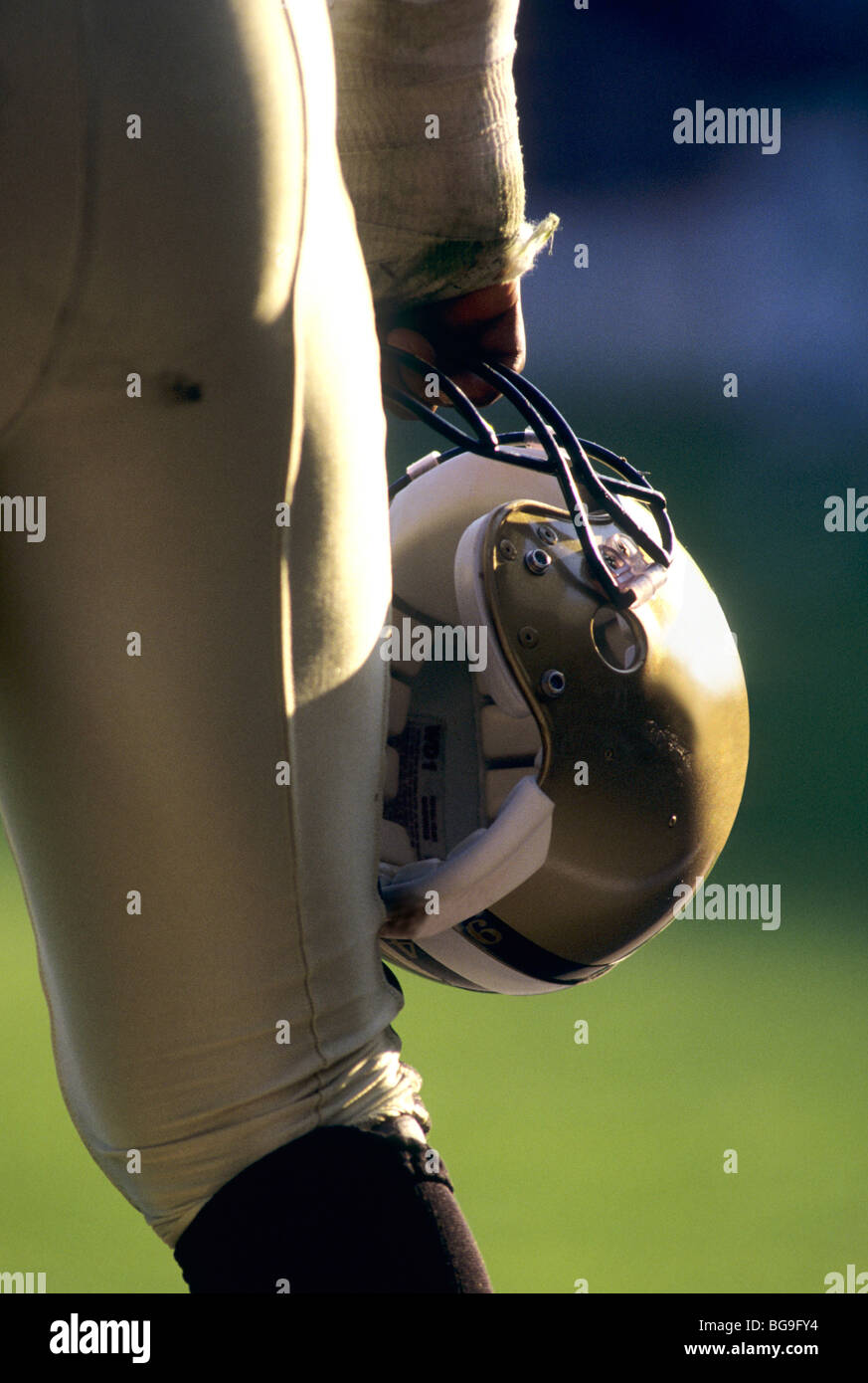 Close up of an American football player holding his helmet Stock Photo ...