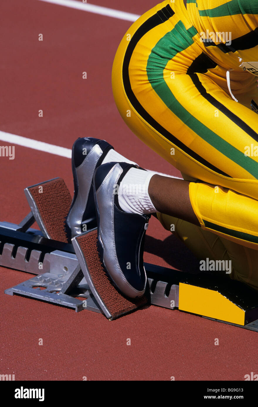 Male sprinter in blocks hi-res stock photography and images - Alamy