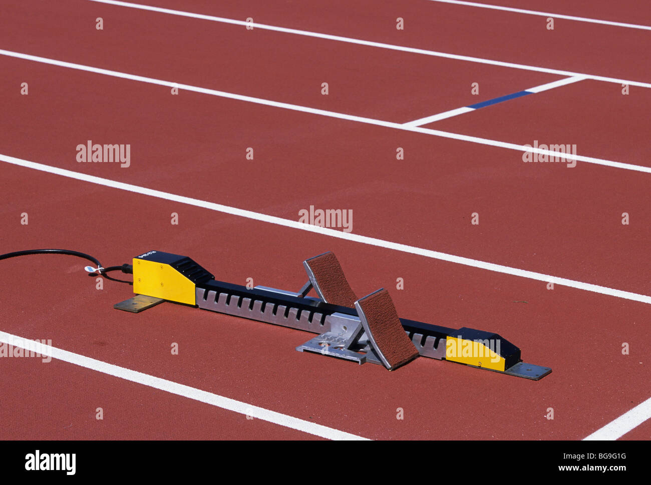 Starting block on an running track Stock Photo - Alamy