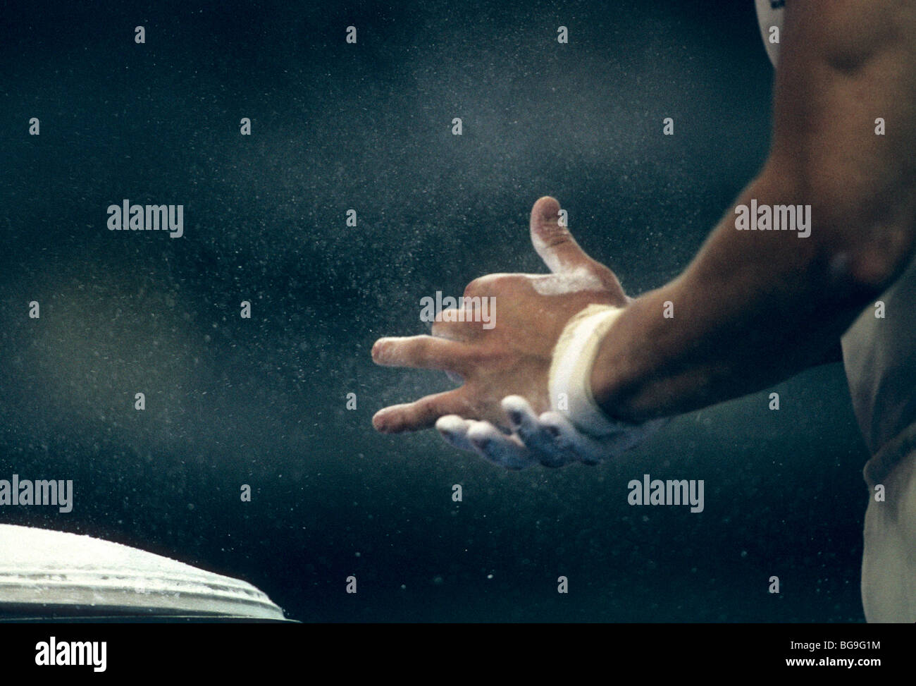 male gymnast chalking hands Stock Photo - Alamy