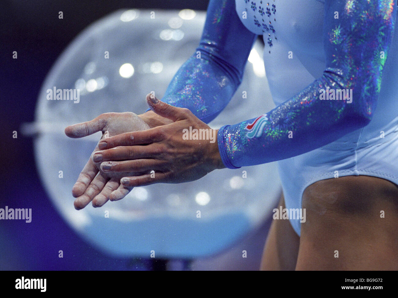 female gymnast chalking hands Stock Photo - Alamy