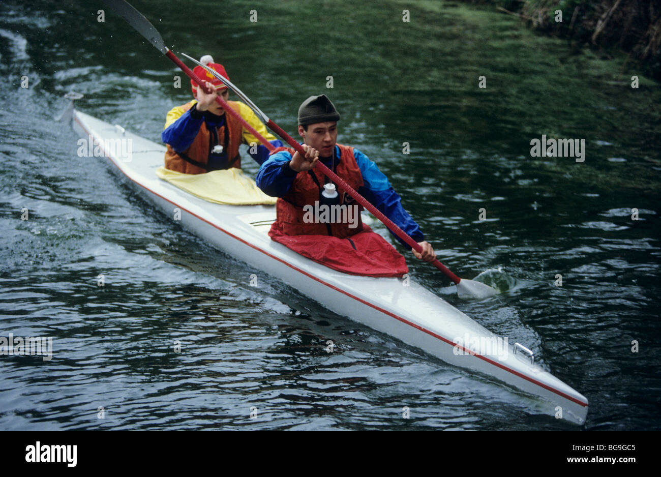 Two men Kayaking on a river Stock Photo - Alamy
