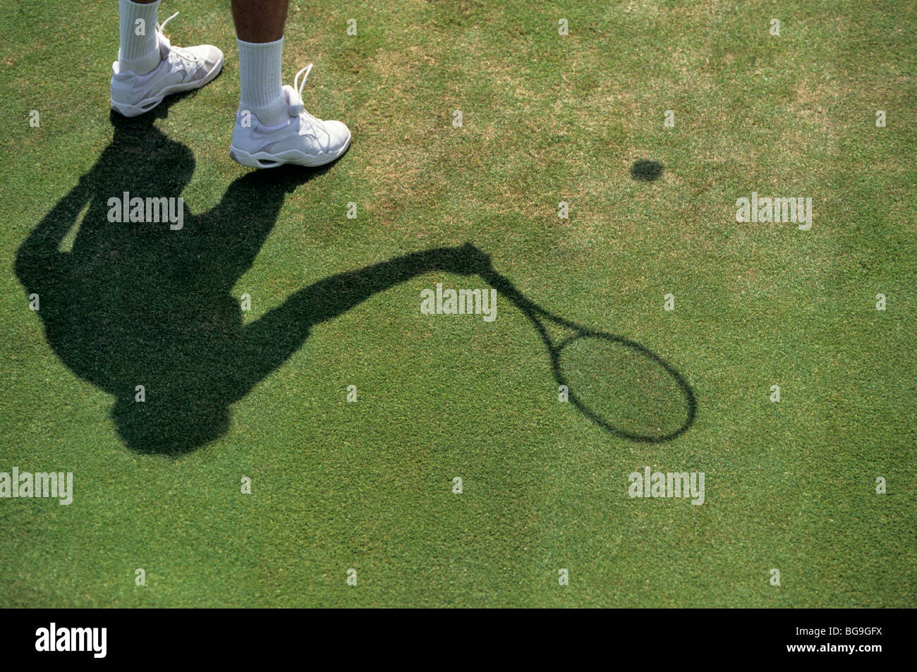 Tennis player and shadow on a tennis court hi-res stock photography and ...