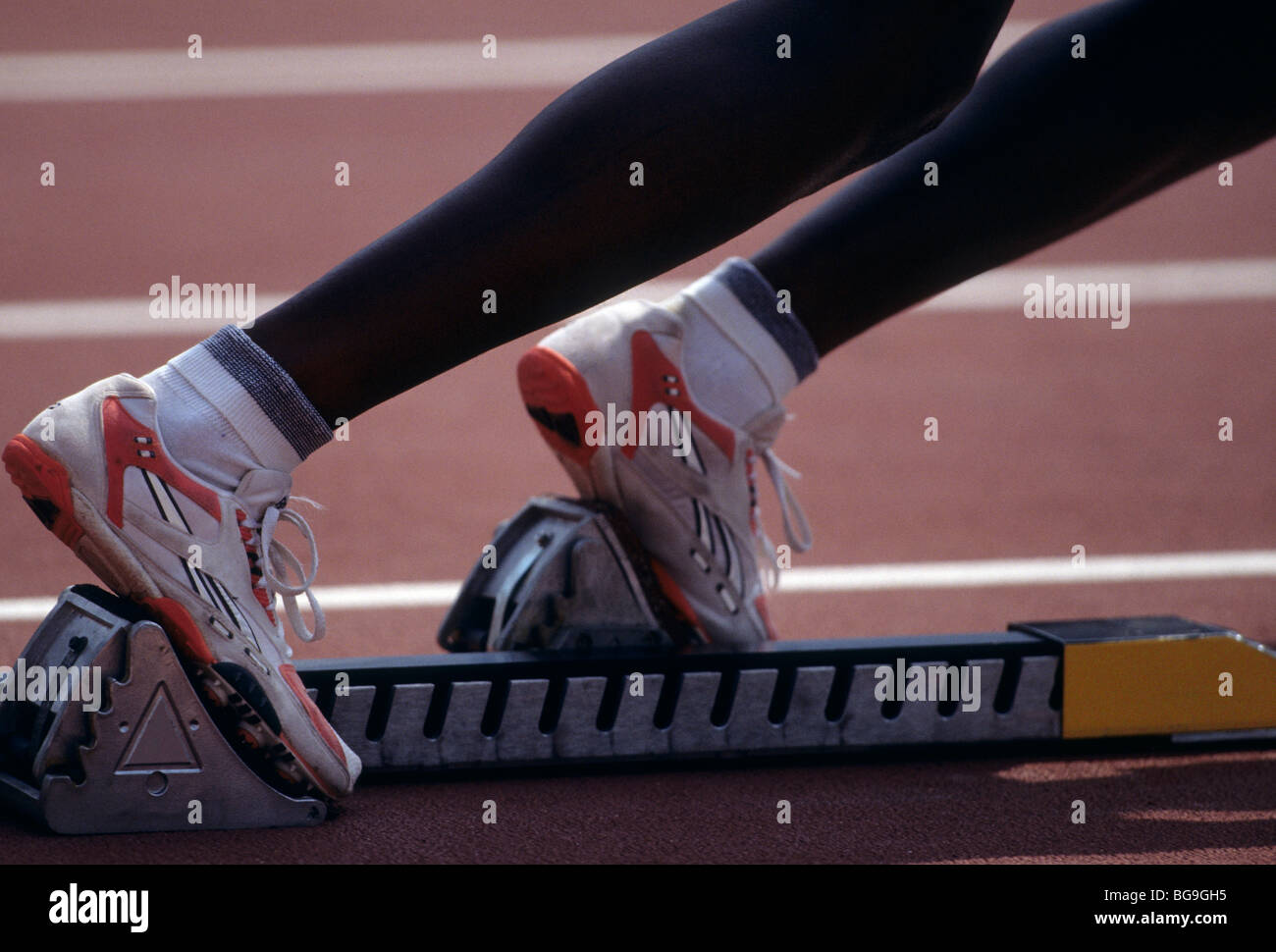 Sprinter taking off from the starting block Stock Photo - Alamy