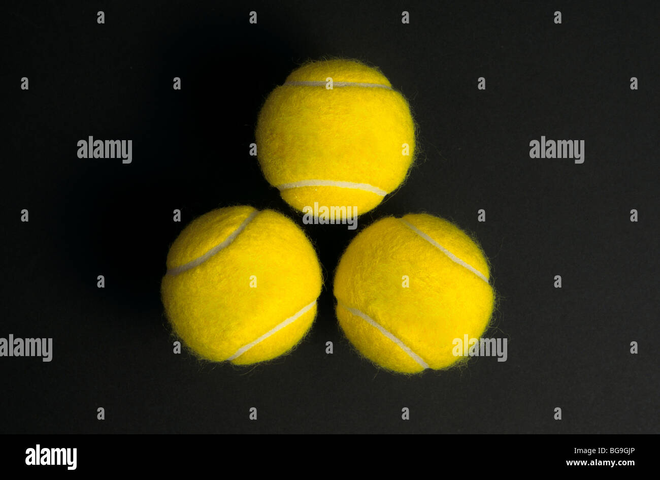 Three tennis balls Stock Photo - Alamy