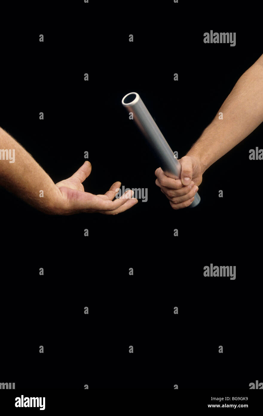 Two athletes passing baton hi-res stock photography and images - Alamy