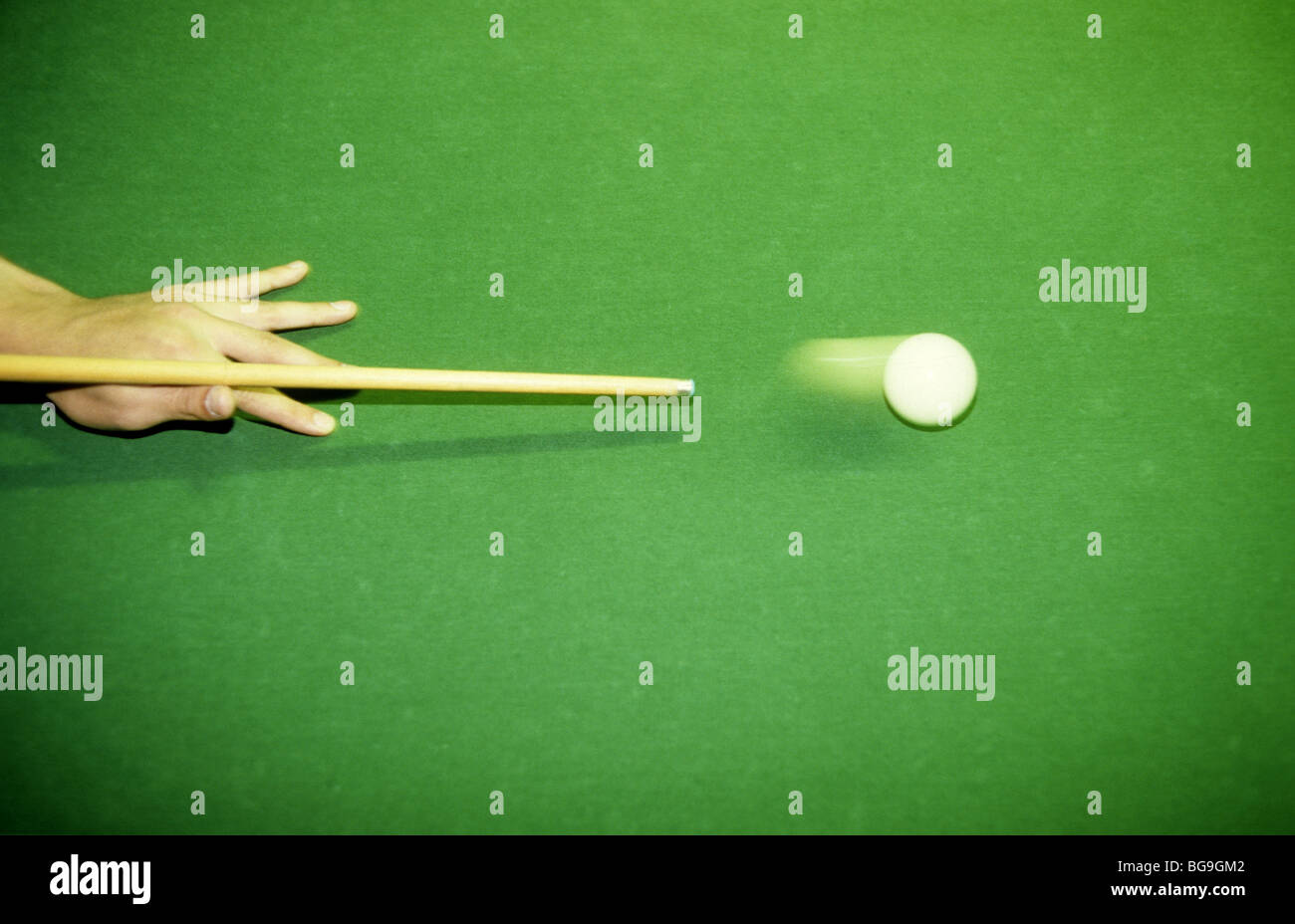 Action shot of a man playing white snooker ball Stock Photo - Alamy