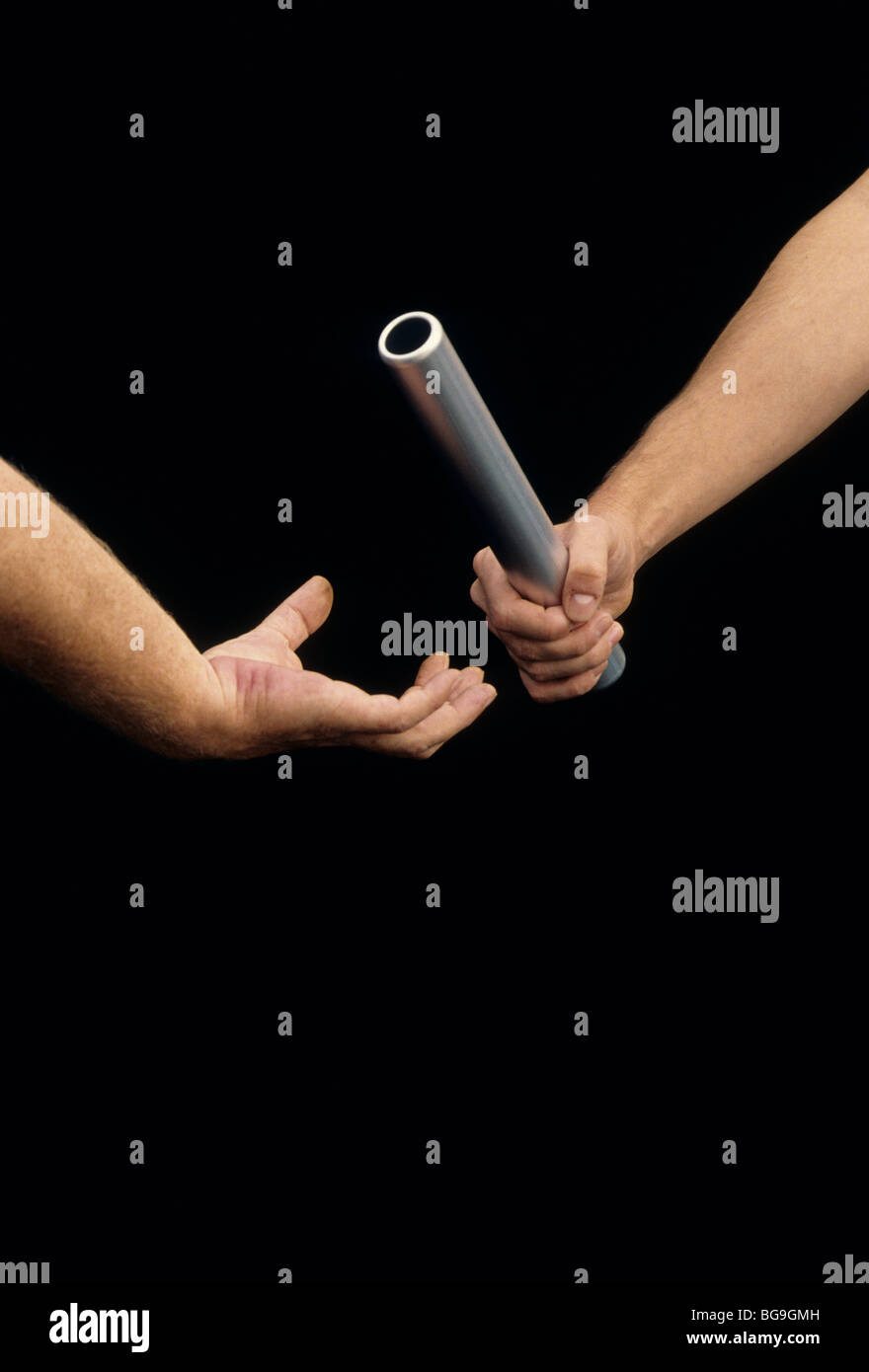 Two athletes passing baton hi-res stock photography and images - Alamy