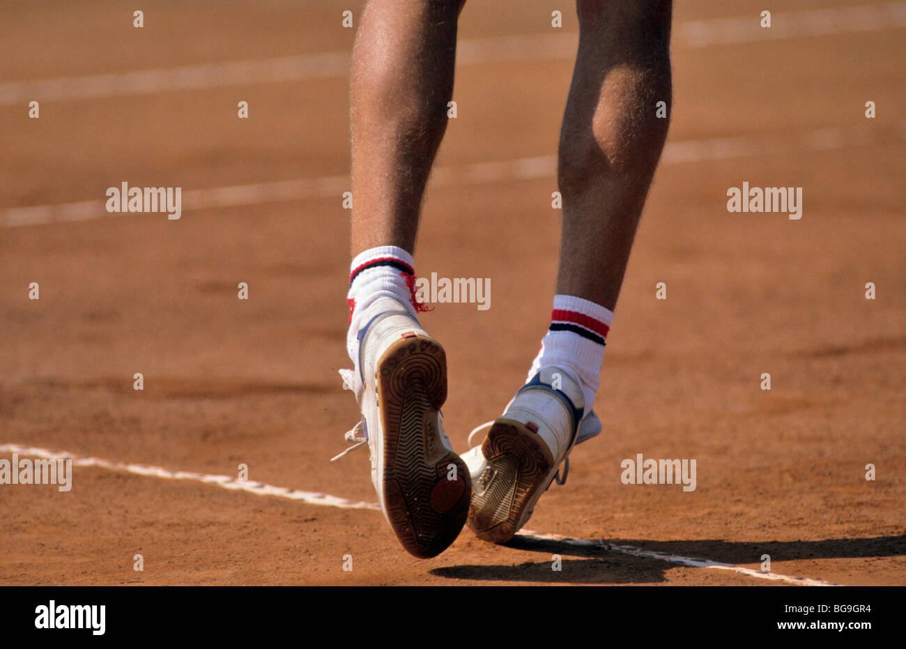 Tennis player on a clay court Stock Photo - Alamy