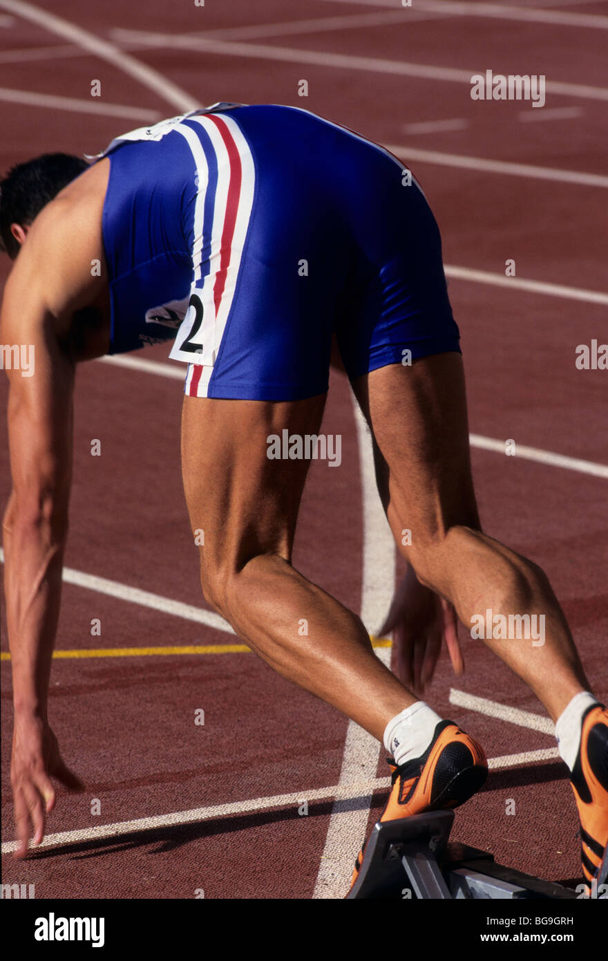 Sprinter in the starting block Stock Photo - Alamy